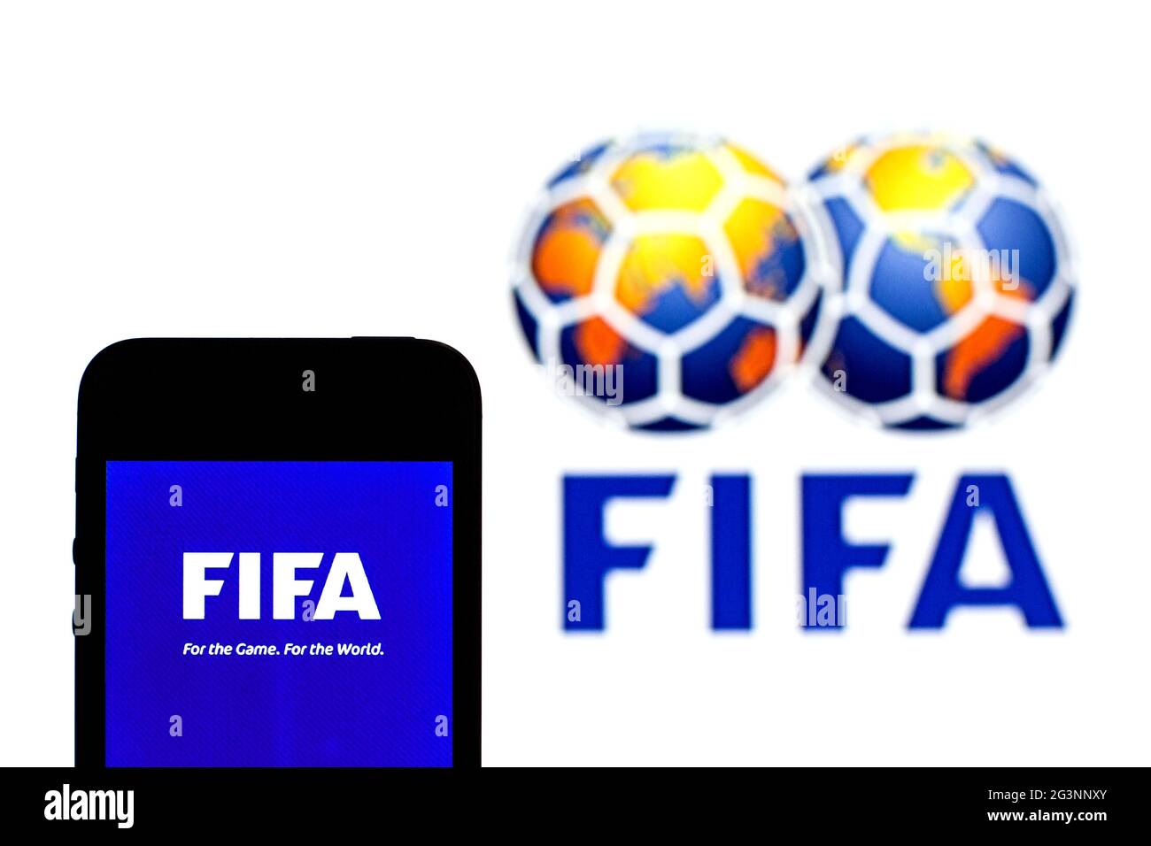In this photo illustration a FIFA logo seen displayed on a smartphone ...