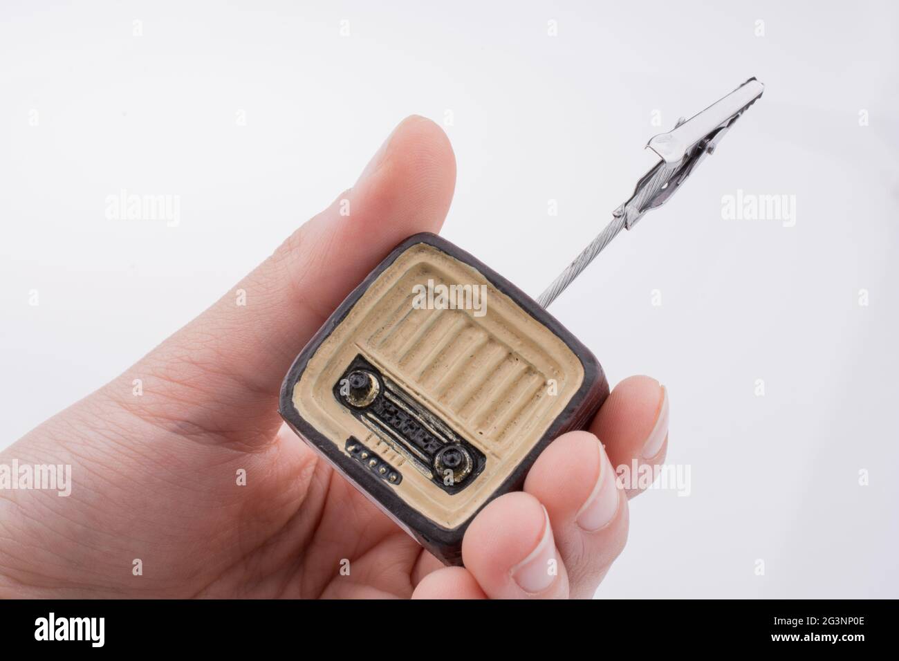 Hand holding a TV Stock Photo - Alamy