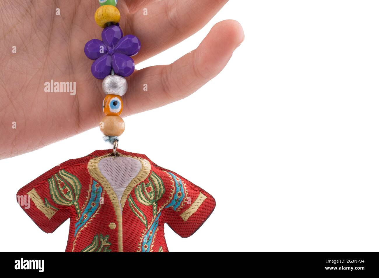 Hand holding clothes Stock Photo - Alamy
