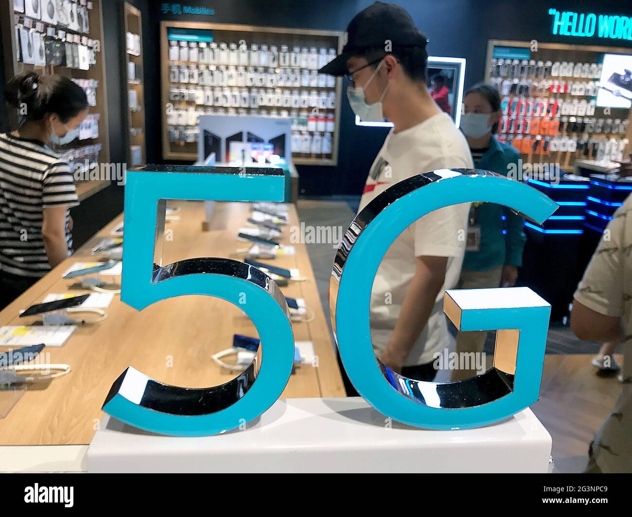 Beijing, China. 17th June, 2021. Chinese consumers look at 5G ...