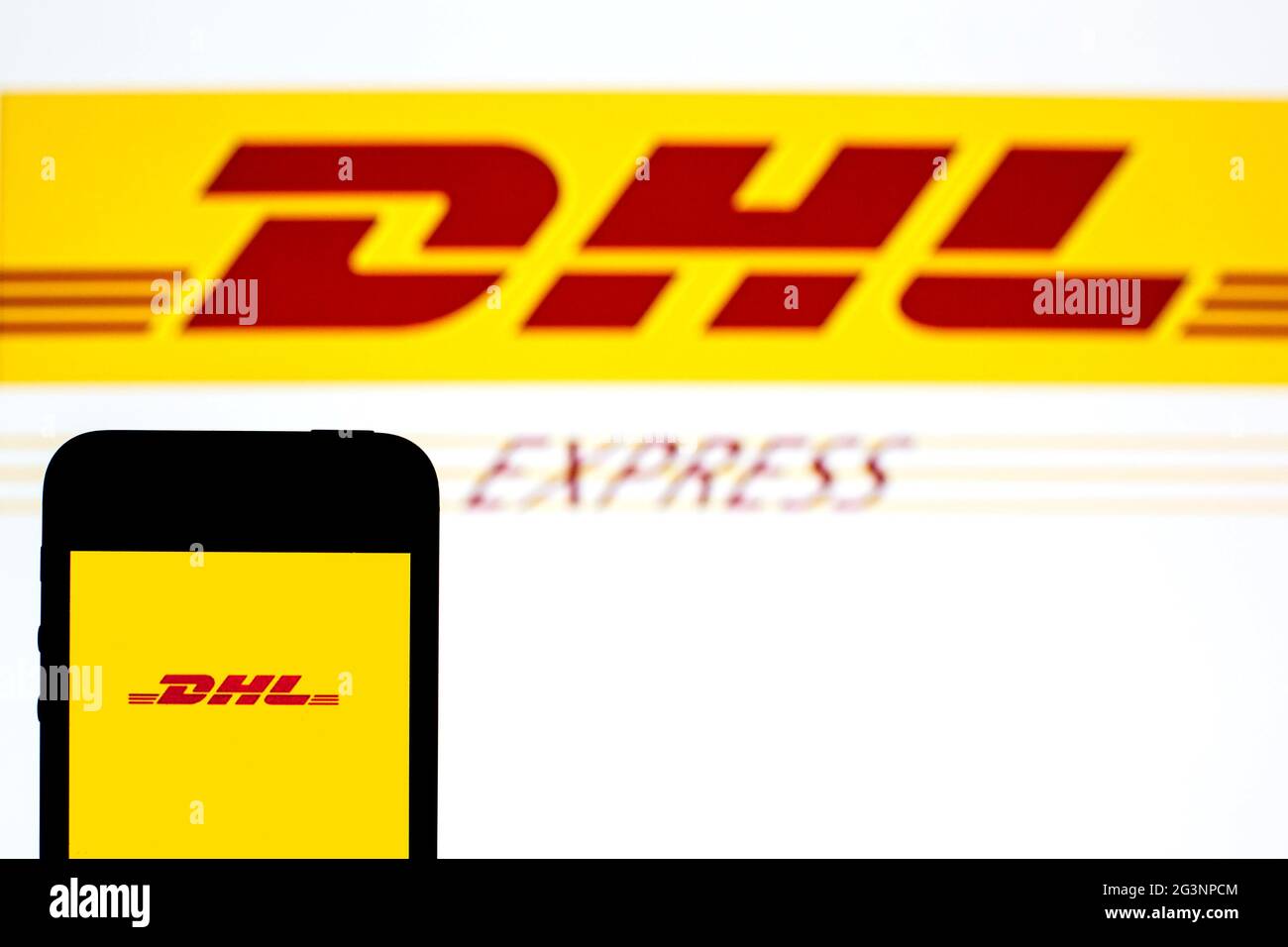 Spain. 16th June, 2021. In this photo illustration a DHL logo seen ...