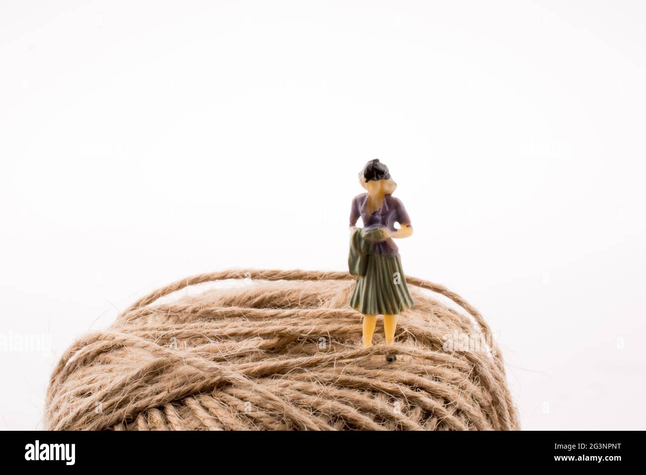 Woman with a linen spool of thread Stock Photo - Alamy