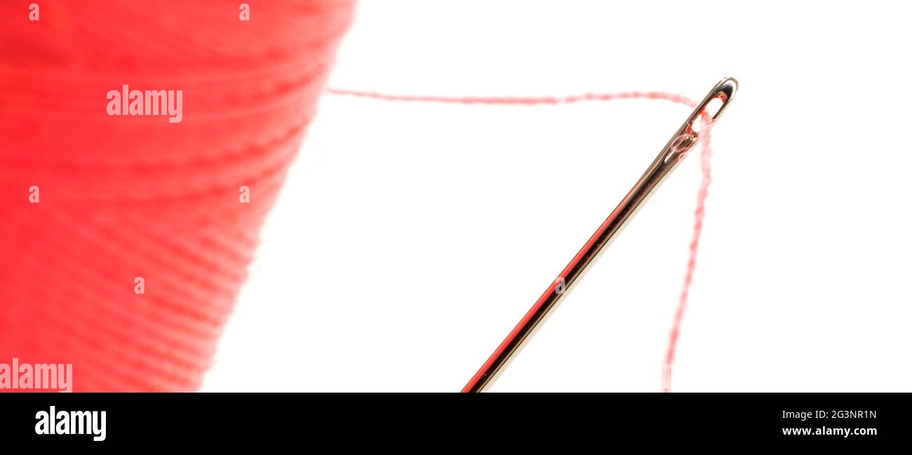 Sewing thread with needle Stock Photo - Alamy