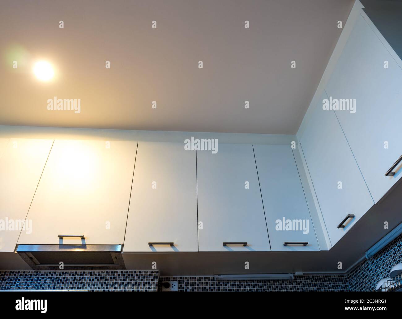 White Built-in storage cabinet above the kitchen counter Stock Photo ...