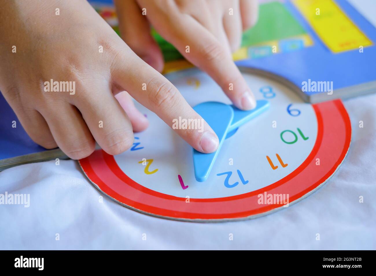 kid play telling time game, young children to learn how to read an ...