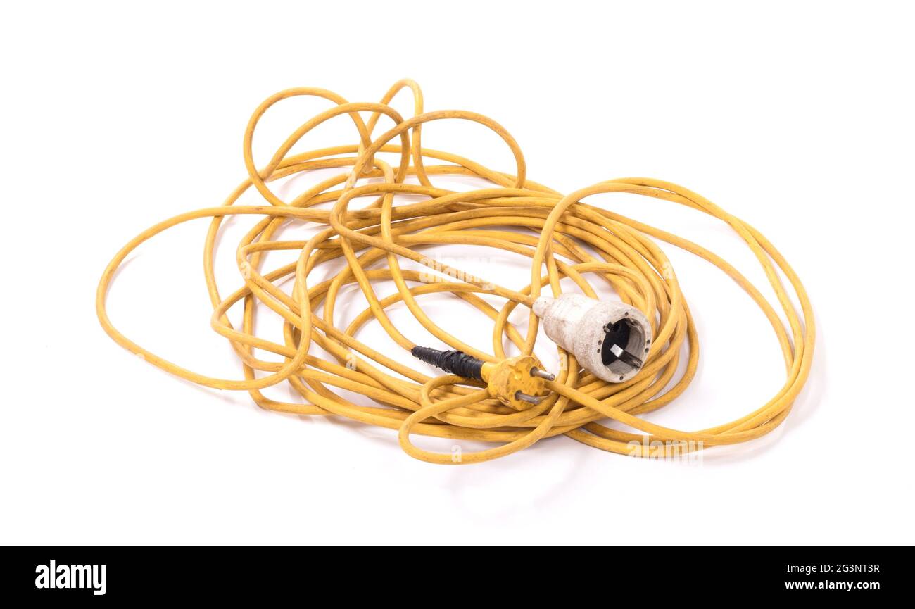Extension cord, old and probably not safe anymore Stock Photo - Alamy
