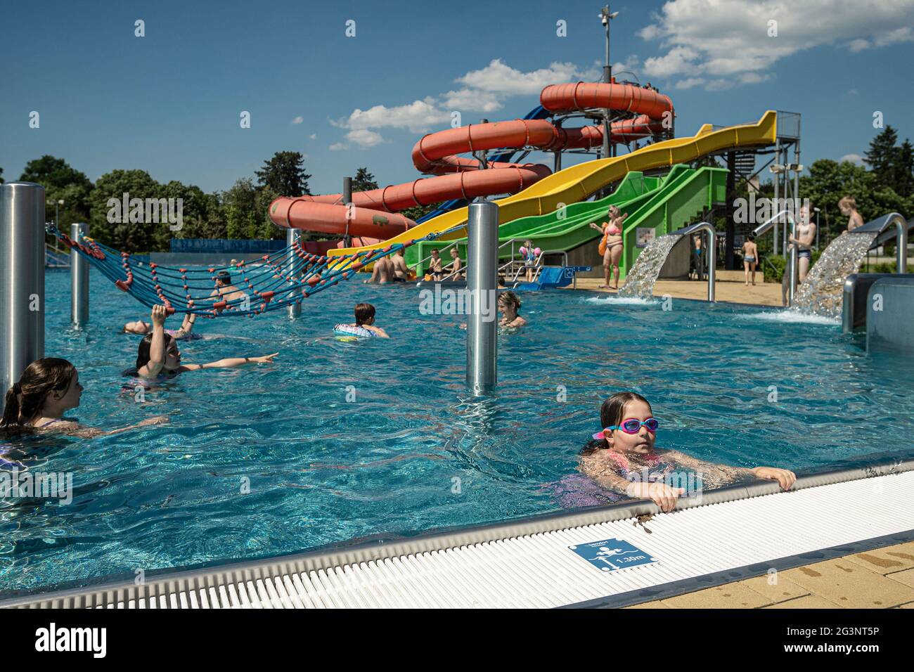 People enjoy a hot sunny day at the Maskova Garden swimming pool in ...
