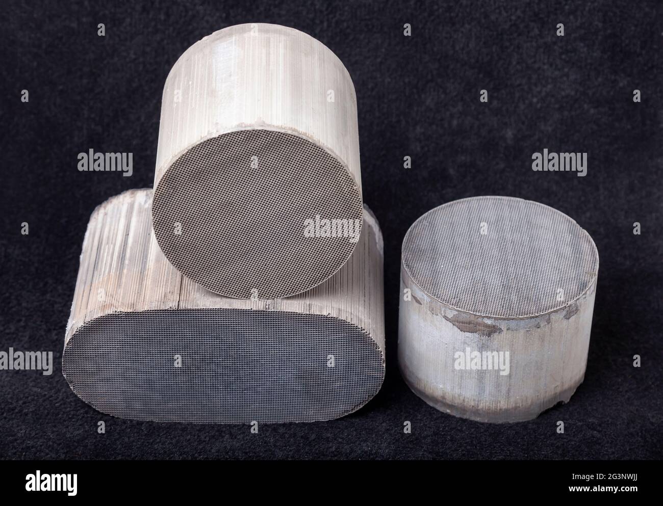 Three round and oval ceramic catalysts containing platinum, palladium ...