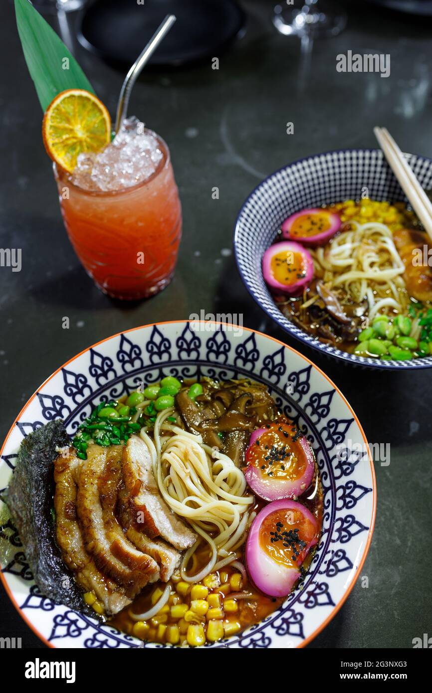 miso soup with eel mushrooms eggs vegetables and udon noodles Stock ...