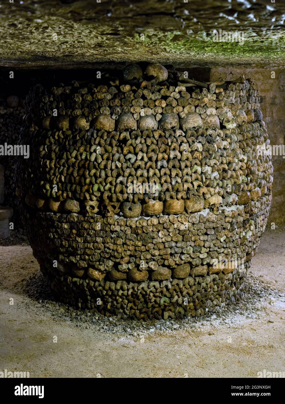 A pillar made of skulls and bones in the Catacomb of Paris, France ...