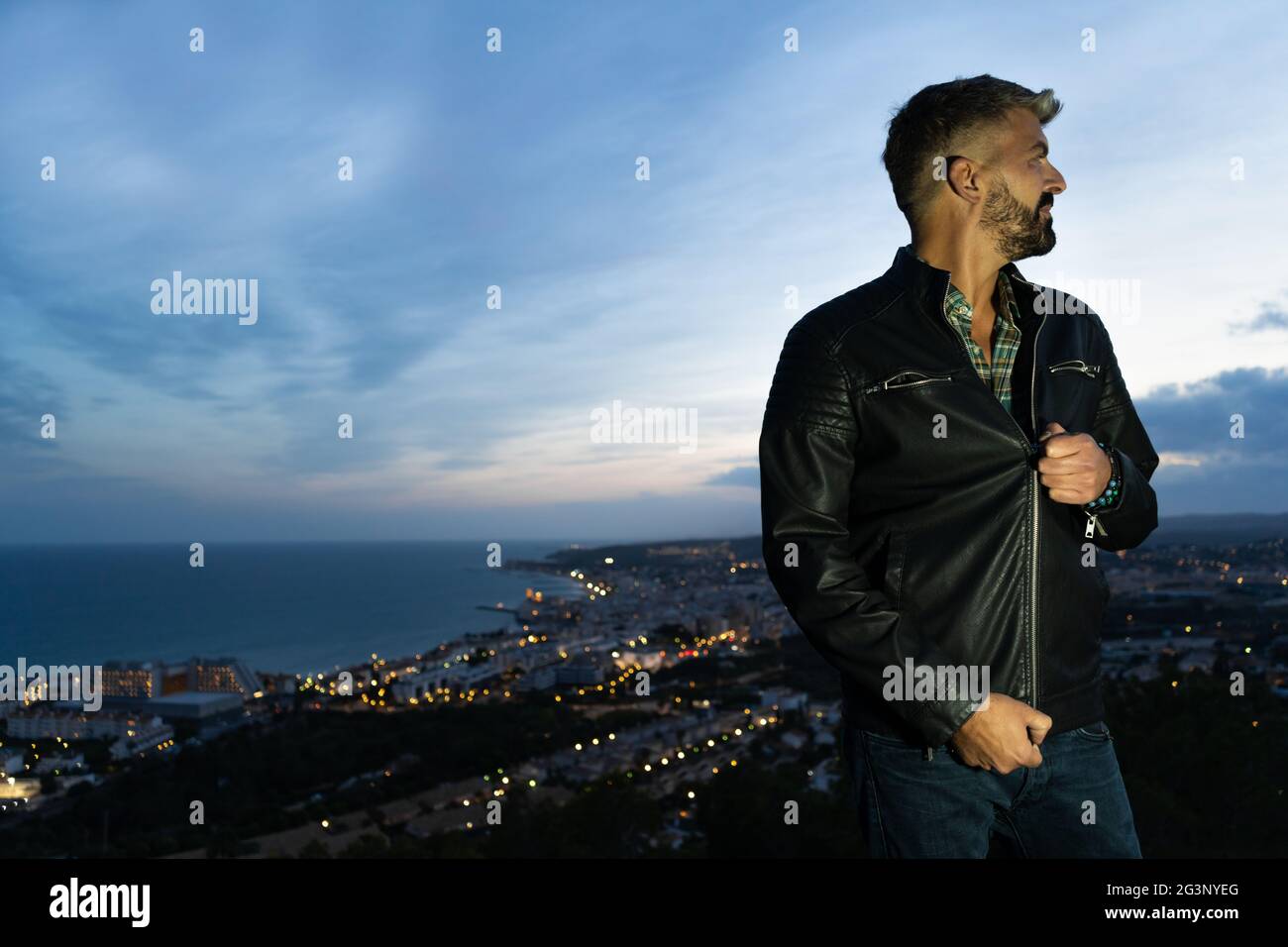 Stylish man at night on beautiful aerial landscape Stock Photo - Alamy