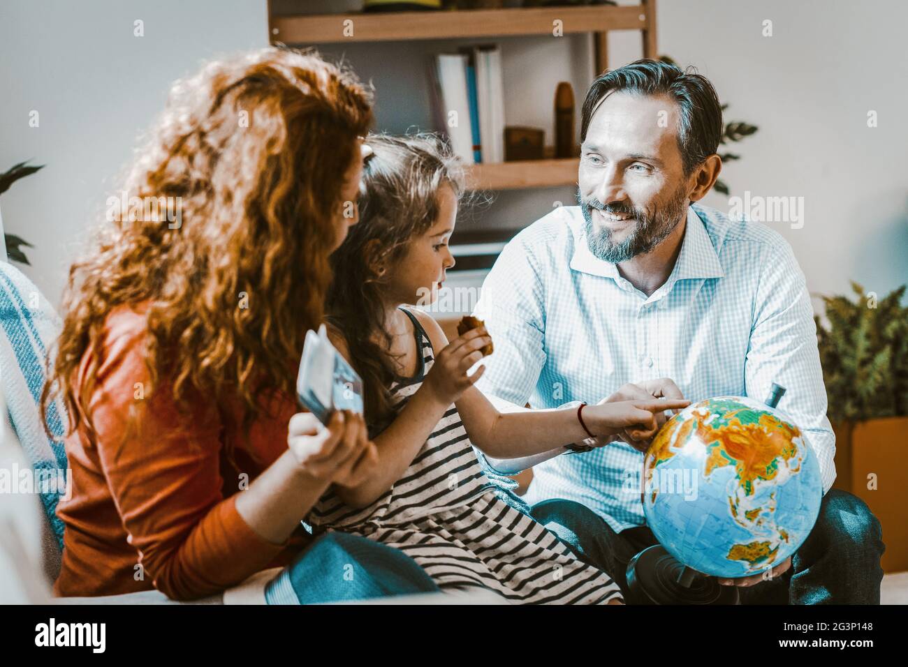 Family travel, parents with little daughter preparing to go on vacation ...