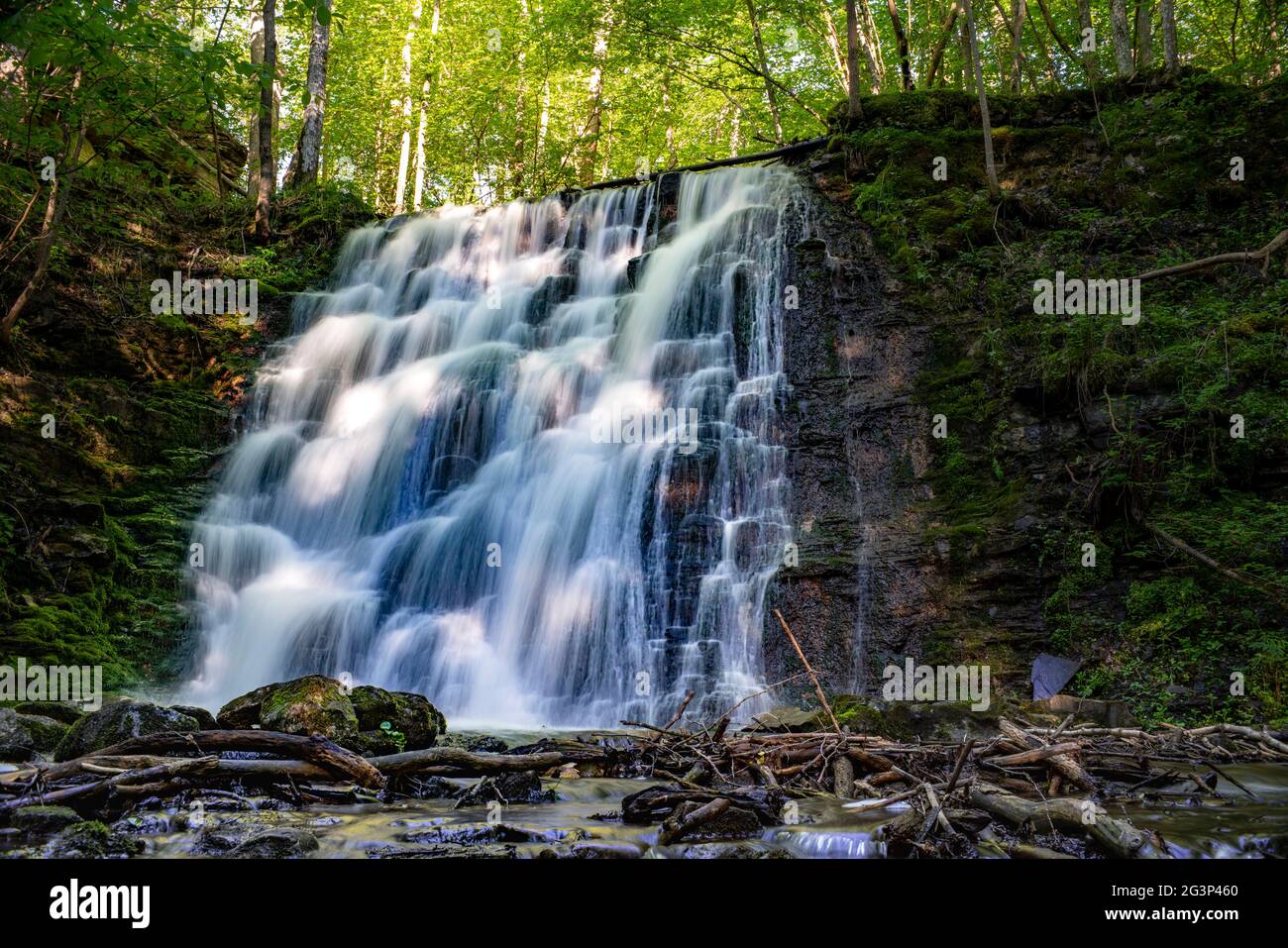 Silverfallet staricase Waterfall in Lush forest and rural mill ...