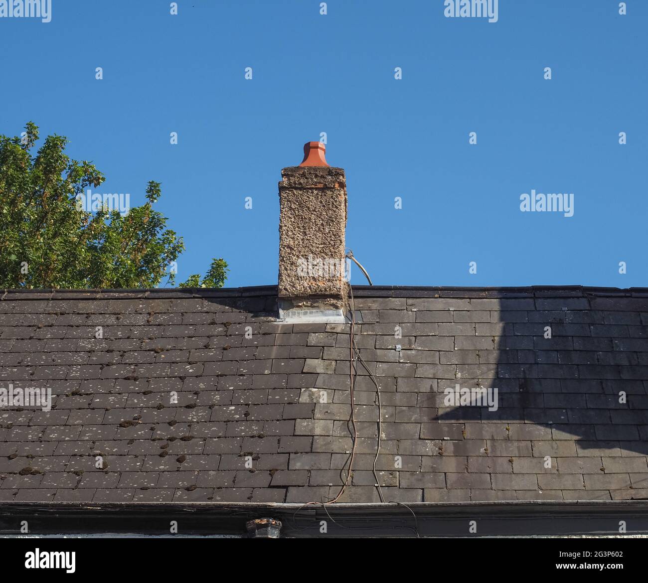 Traditional british roof with chimney Stock Photo - Alamy