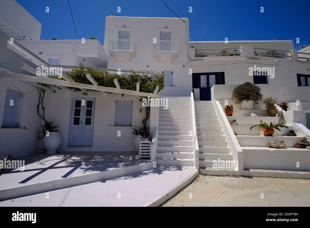Ios, Greece - May 16, 2021 : A whitewashed hotel that rents rooms, with ...
