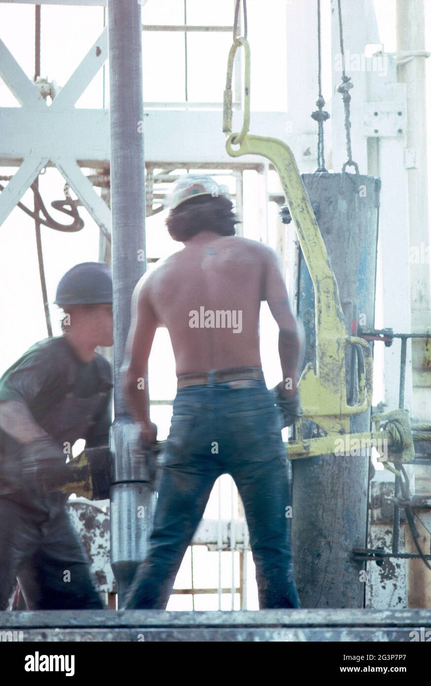 Oil rig workers 'pulling pipe' (digital enhancement). #881-3 Stock ...