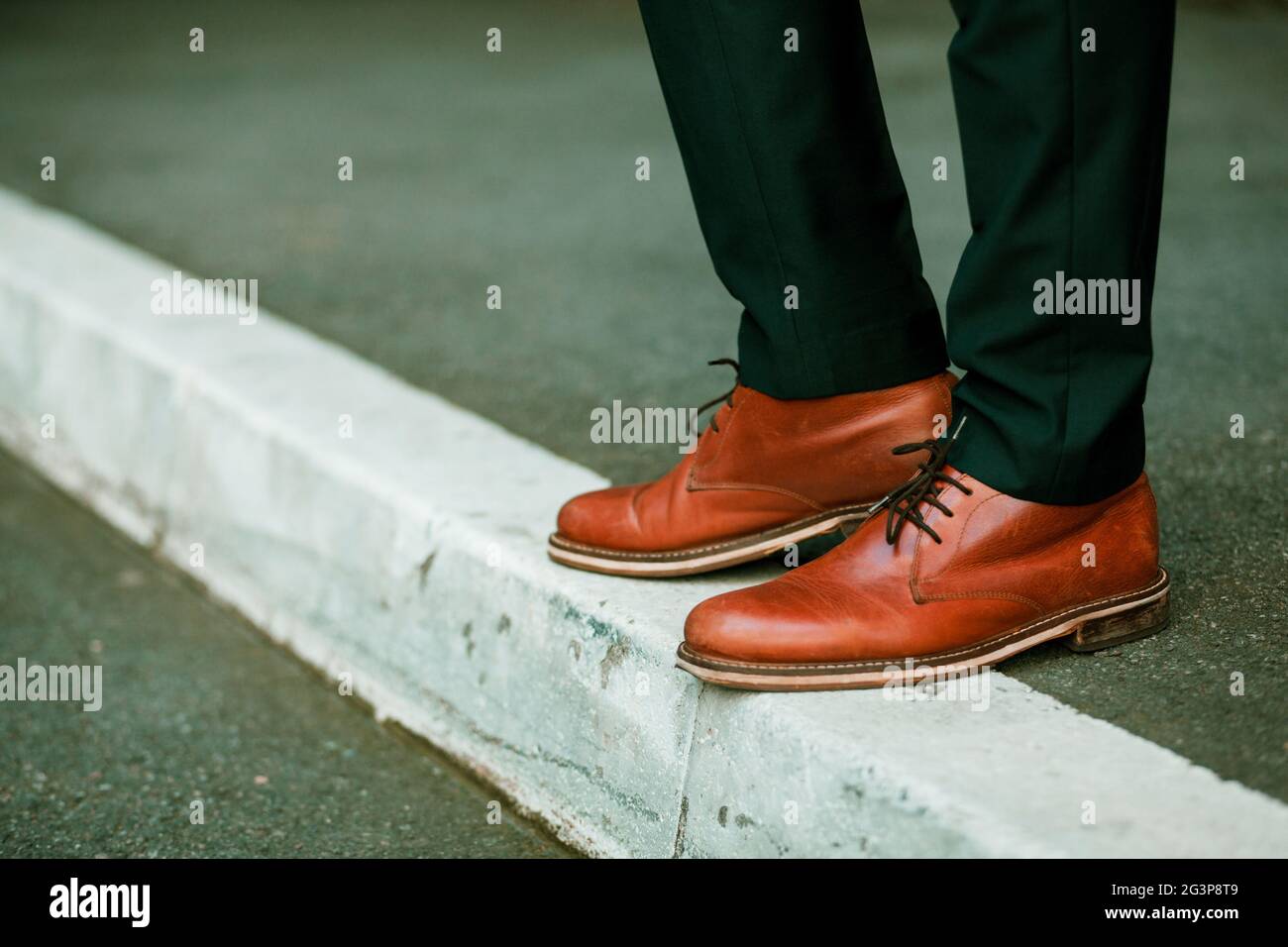 Man's Legs in Brown Boots Stock Photo - Alamy