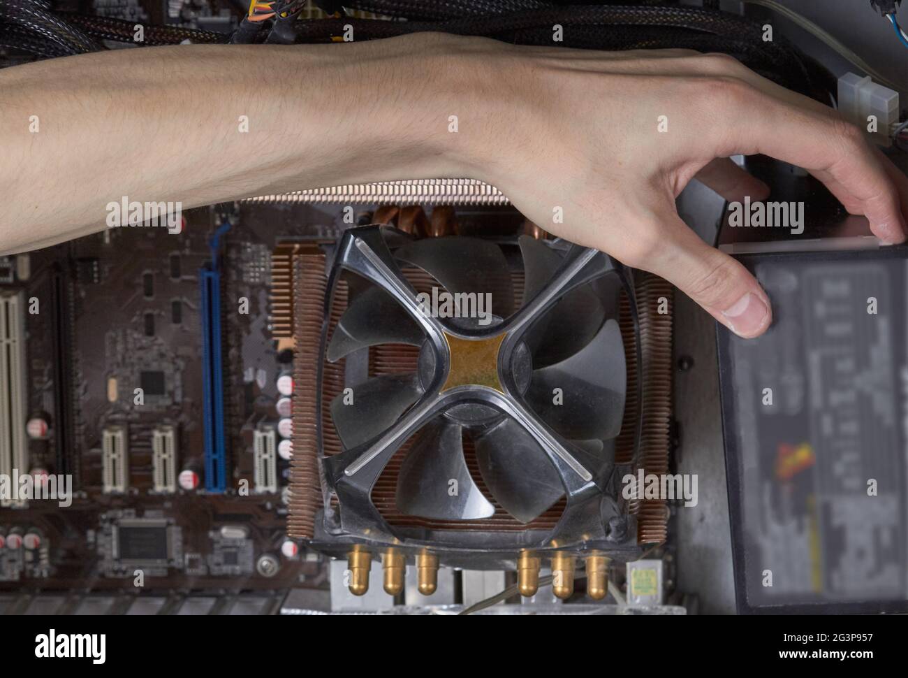 Connecting computer connectors, laying wires, cleaning dust Stock Photo ...