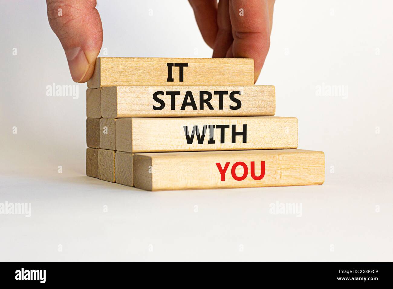It starts with you symbol. Wooden blocks with words 'it starts with you ...