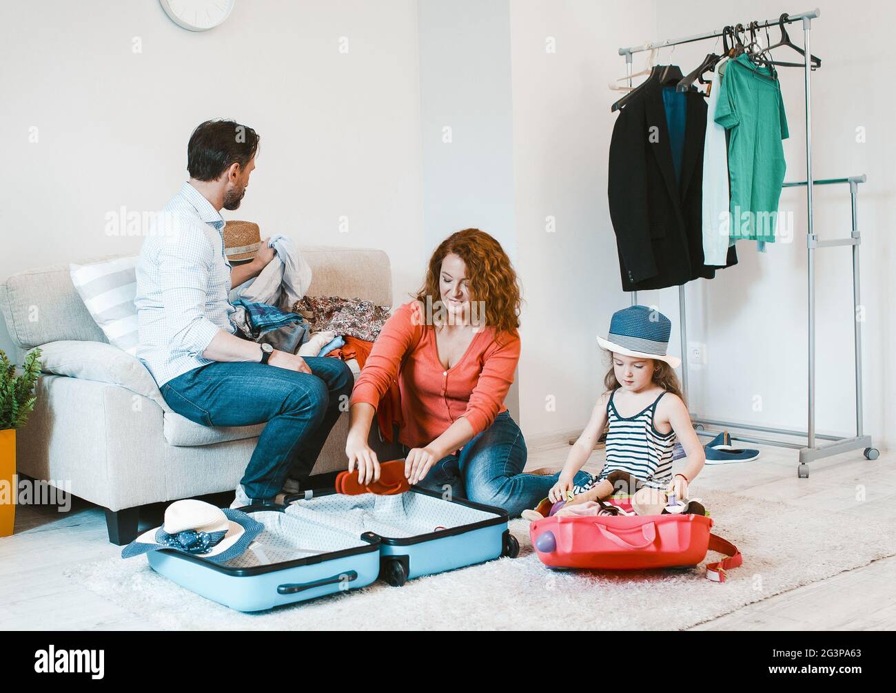 Happy family going on vacation Stock Photo - Alamy