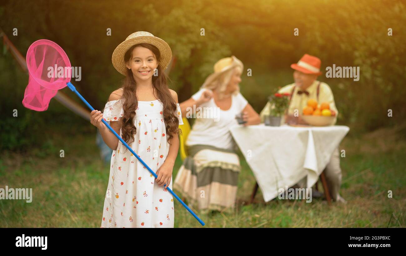 Cute Young Girl With A Pink Butterfly Net Stock Photo - Alamy