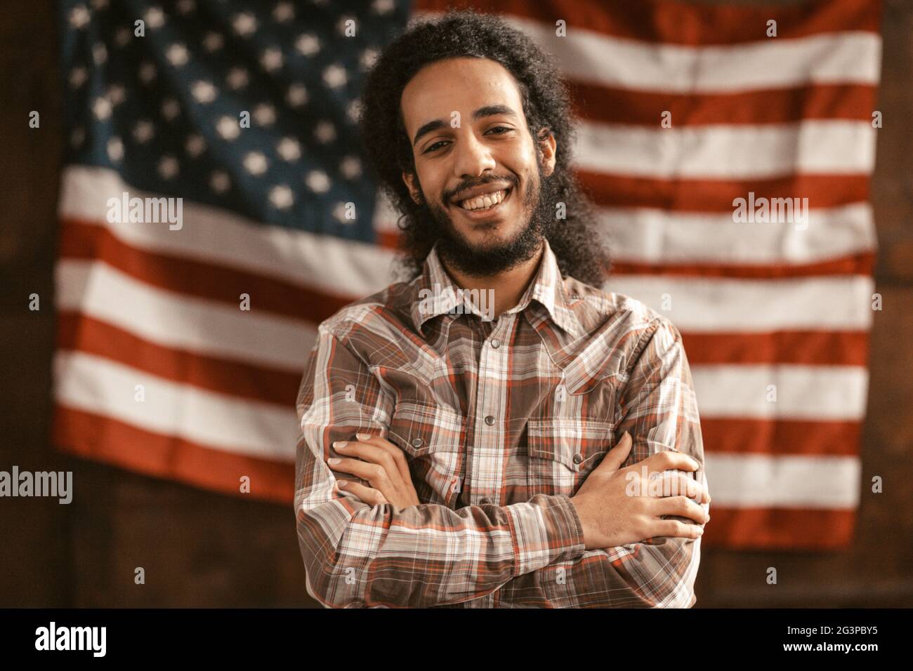 Patriotic American Man Cheerfully Laughs With His Arms Crossed Stock ...