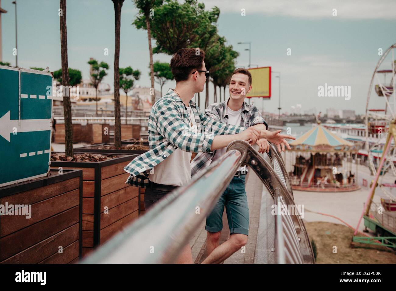 Two male friends talking happily hi-res stock photography and images ...