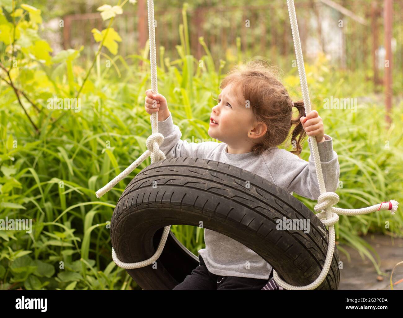 Kid riding a big wheel hi-res stock photography and images - Alamy