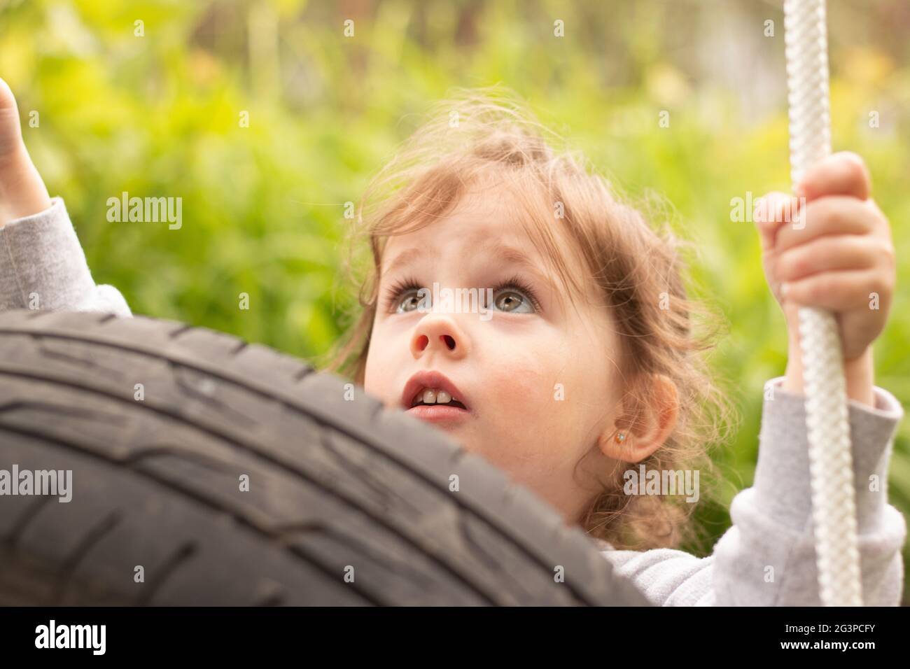 Black kid swinging on rope hi-res stock photography and images - Alamy