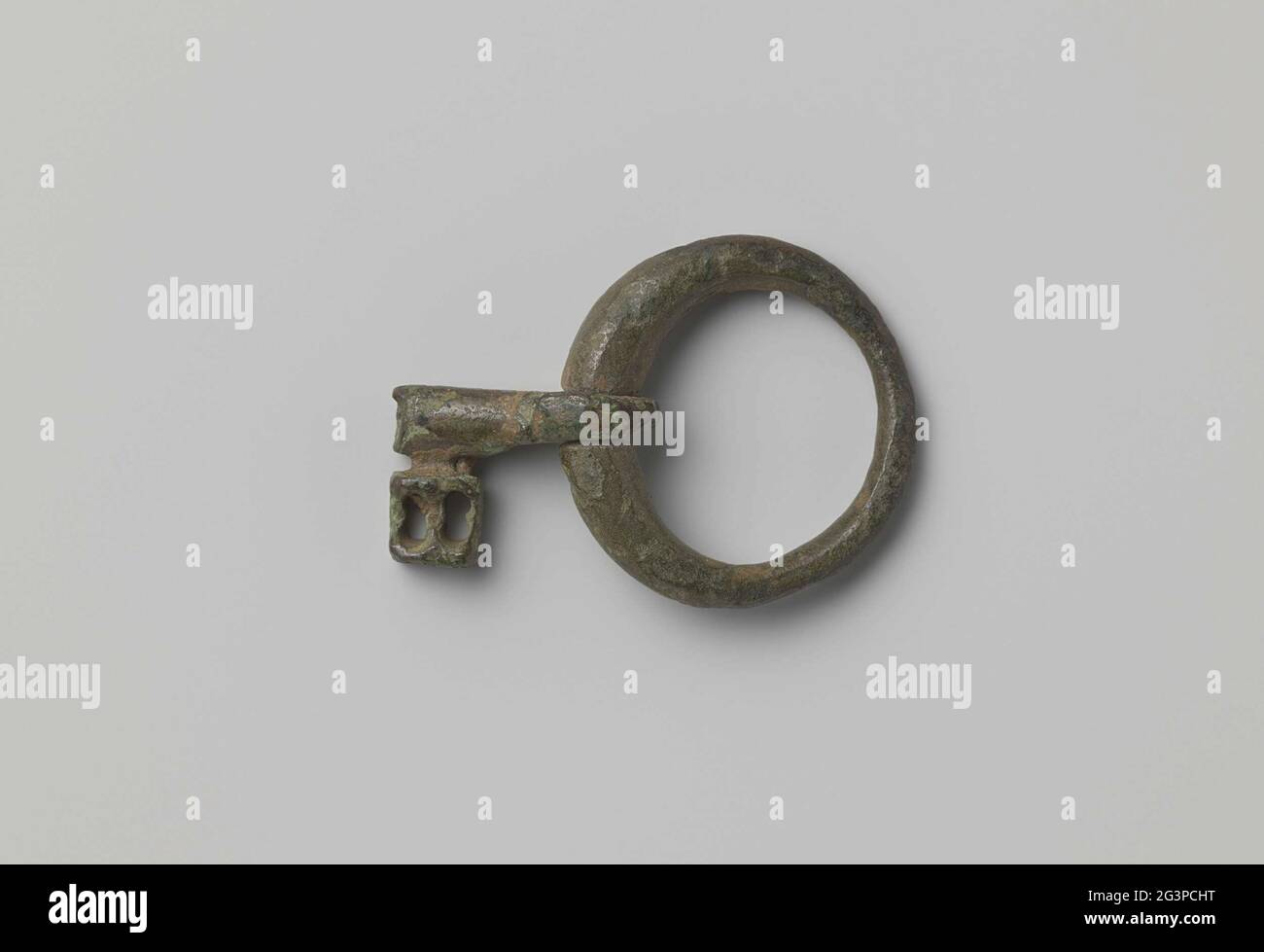 Key. Key with loose ring, which widens below. The square beard has two ...