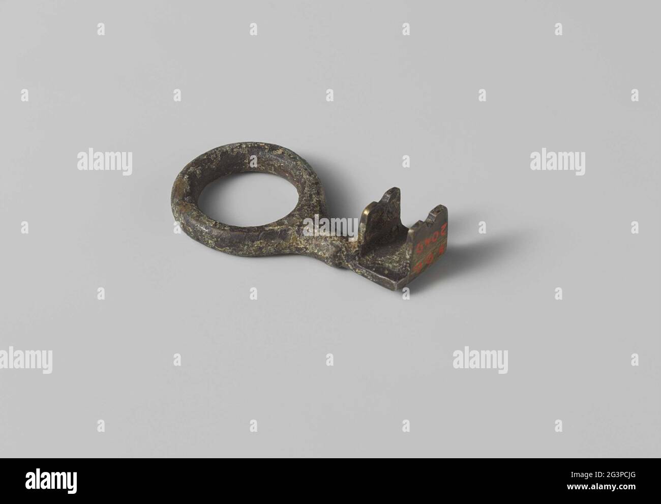 Key. KEY with large acetic eye, short handle and a beard formed by a ...