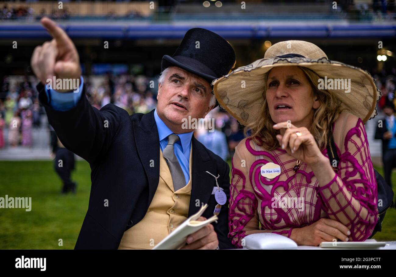 Racegoers Andrew Cowley and Ariane Cowley watch the King George V ...