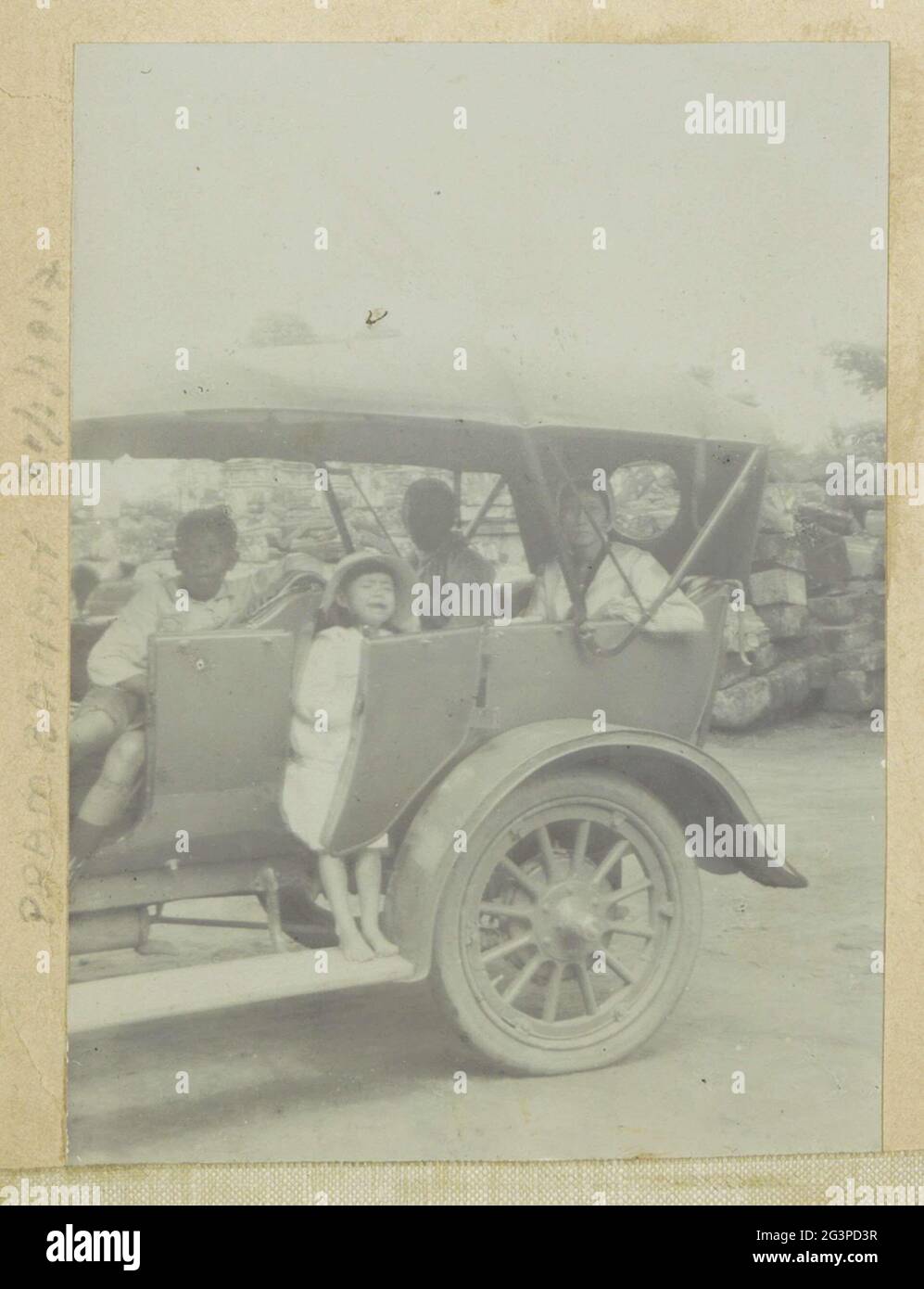 Indian people with crying child in a car in prambanan. Part of family ...