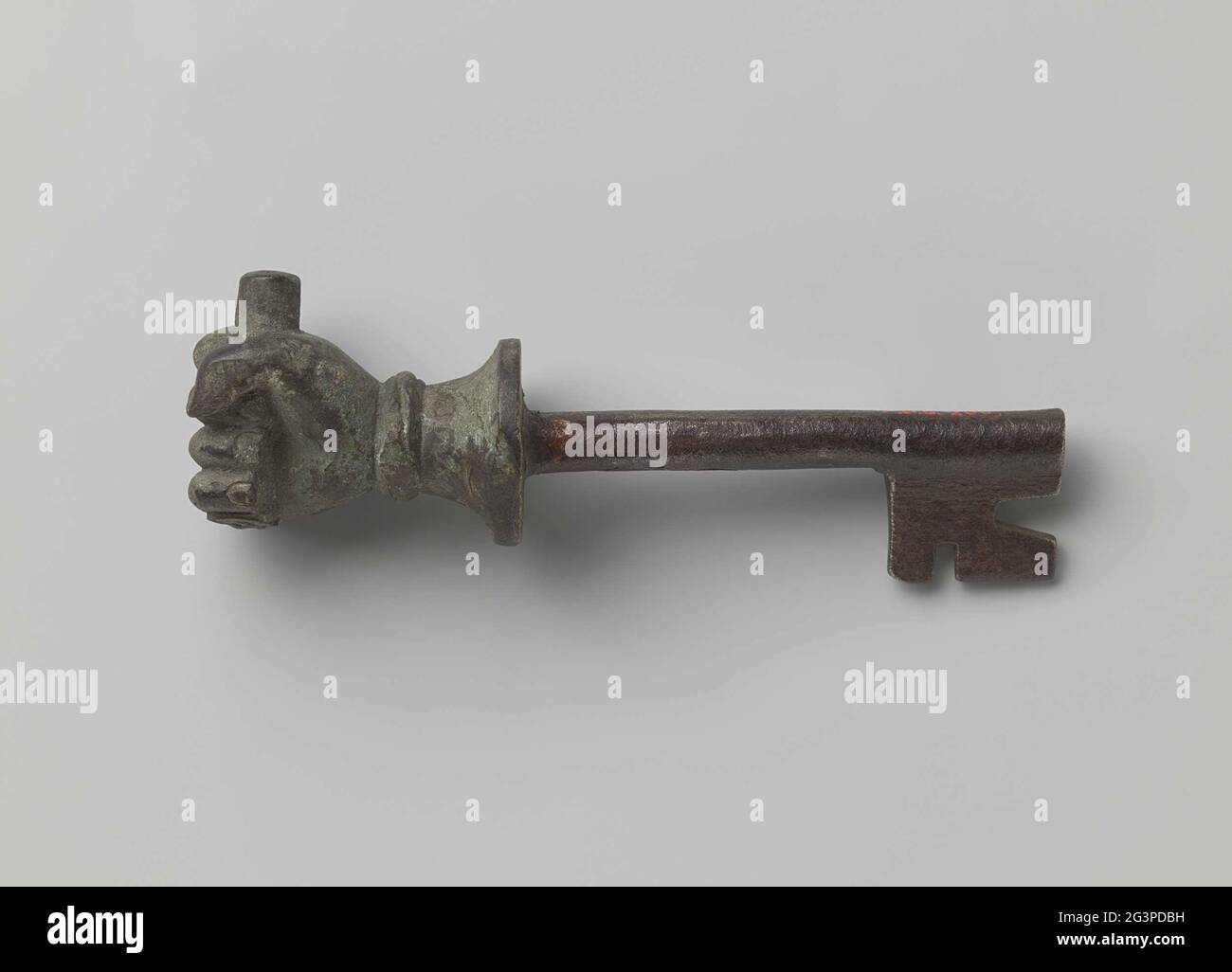 Pipe key. Pipe key with handle in the shape of a fist, a broken staff ...