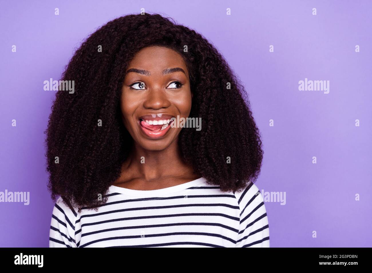 Photo of sweet young millennial lady look empty space wear striped ...