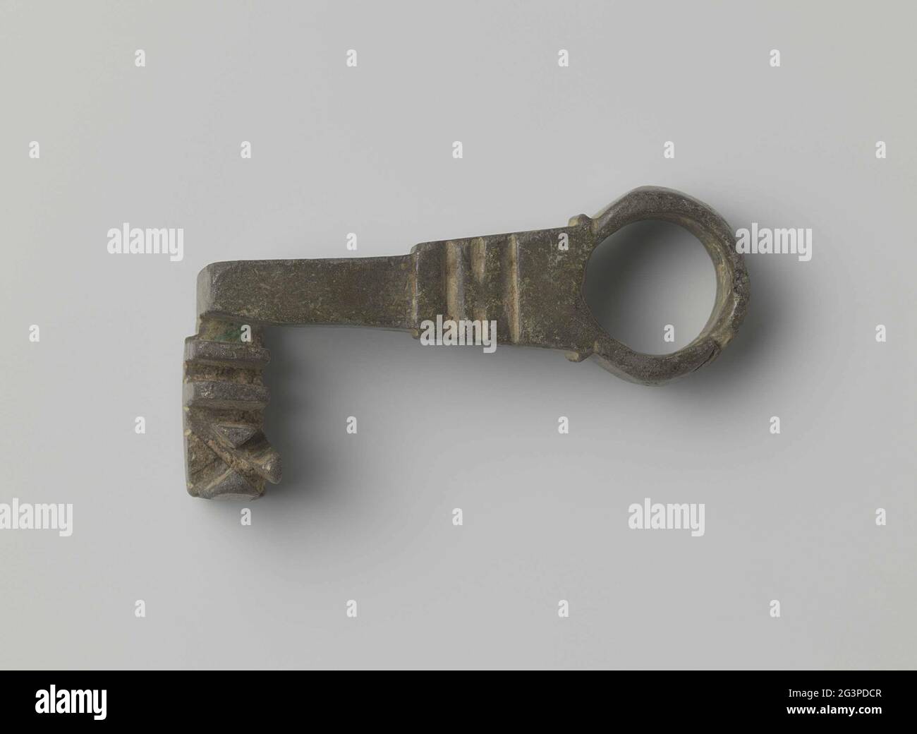 Key from bronze. Bronze key with cross beard, round ring Stock Photo ...
