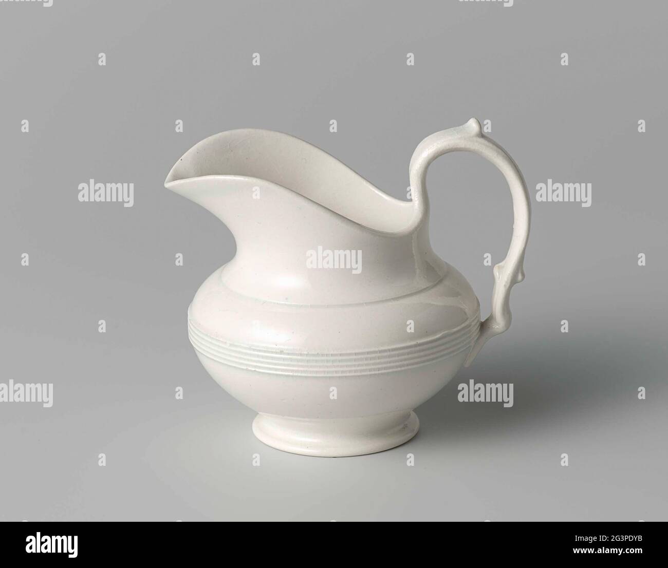 Milk jug, cream colored, with a band with horizontal ridges on the ... Milk jug, cream colored, with a band with horizontal ridges on the ...