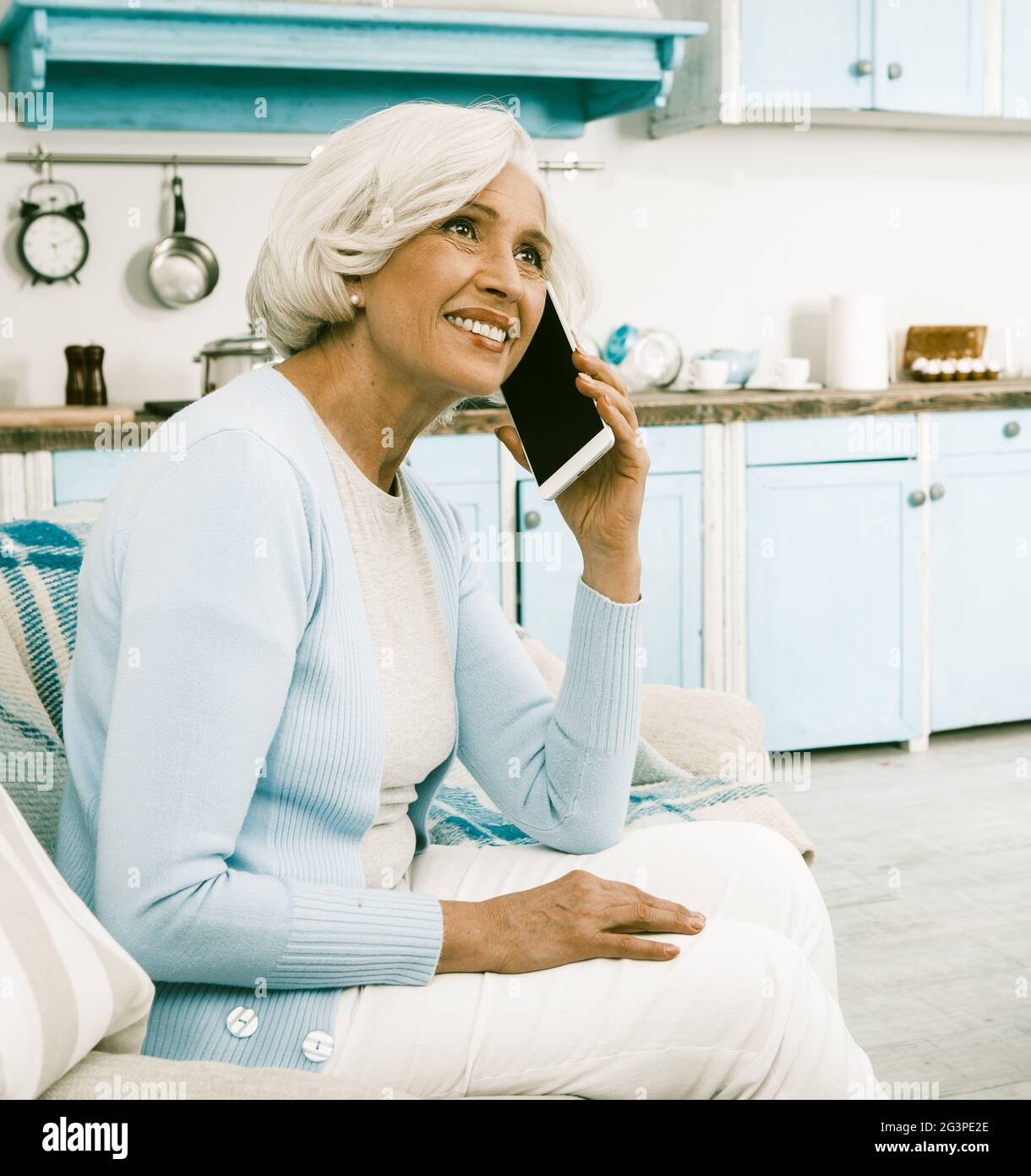 Happy Senior Lady Using Mobile Phone At Home Stock Photo - Alamy