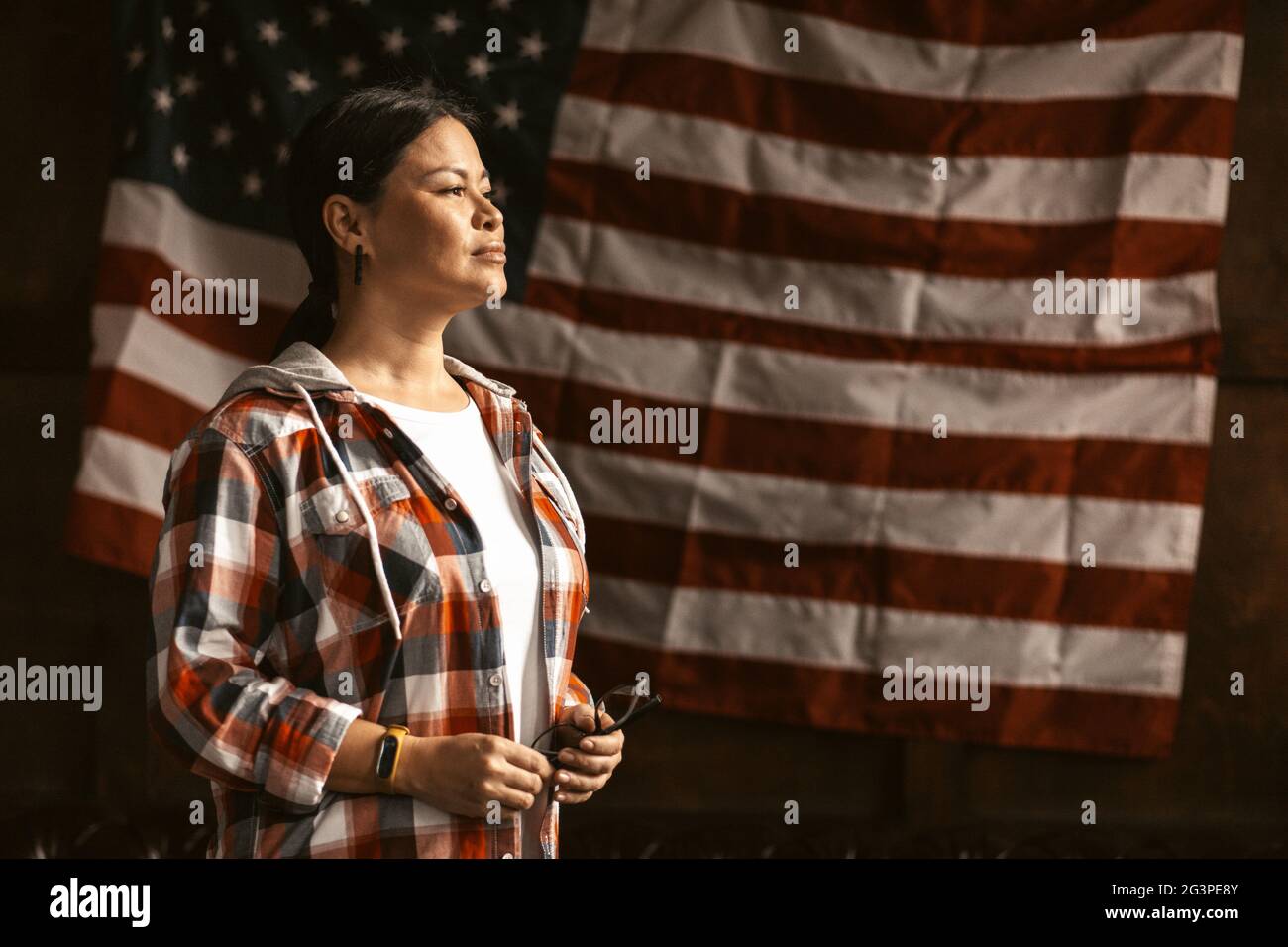 American Citizen Smiles Patriotically Against Backdrop Of Striped USA ...