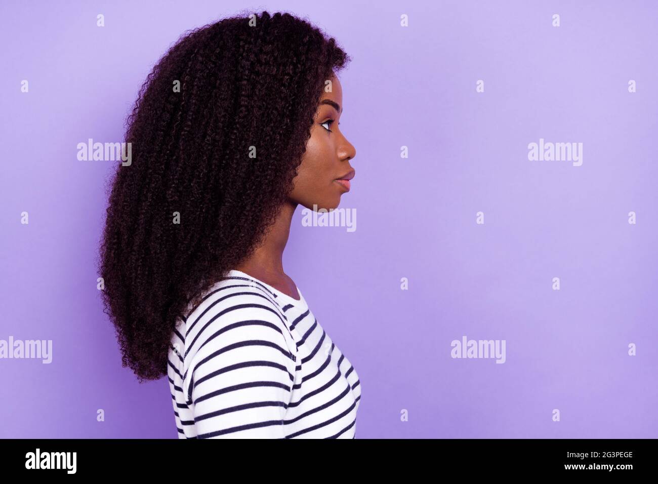 Profile photo of confident young lady look empty space wear striped ...