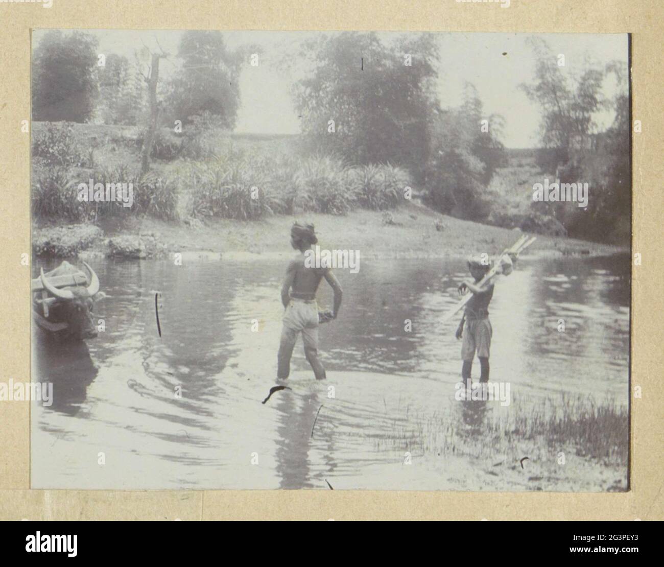 Indian boys at a car building in the Dutch East Indies. Part of family ...