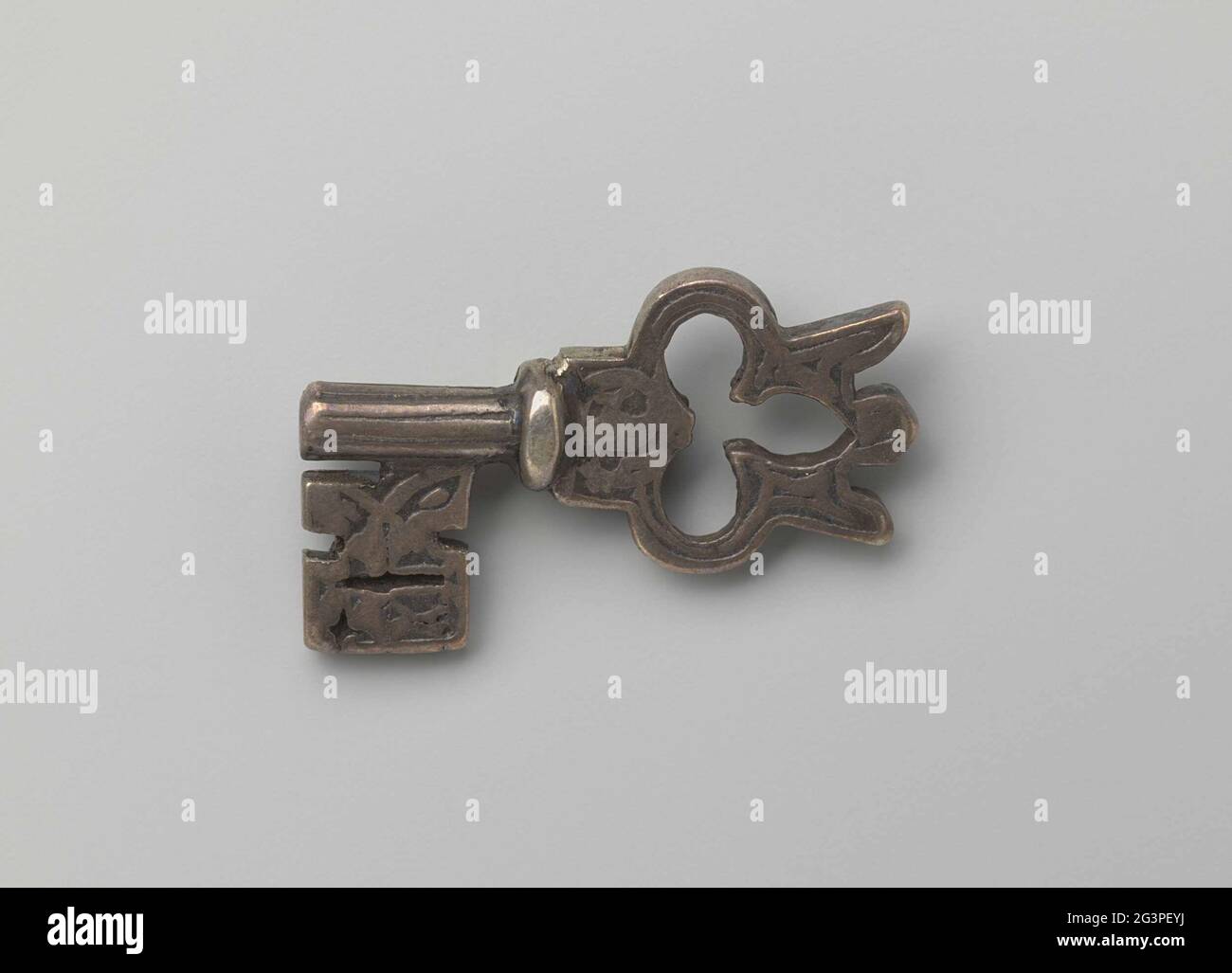 Miniature key. Miniature key with clover sheet-shaped eye, up in a ...