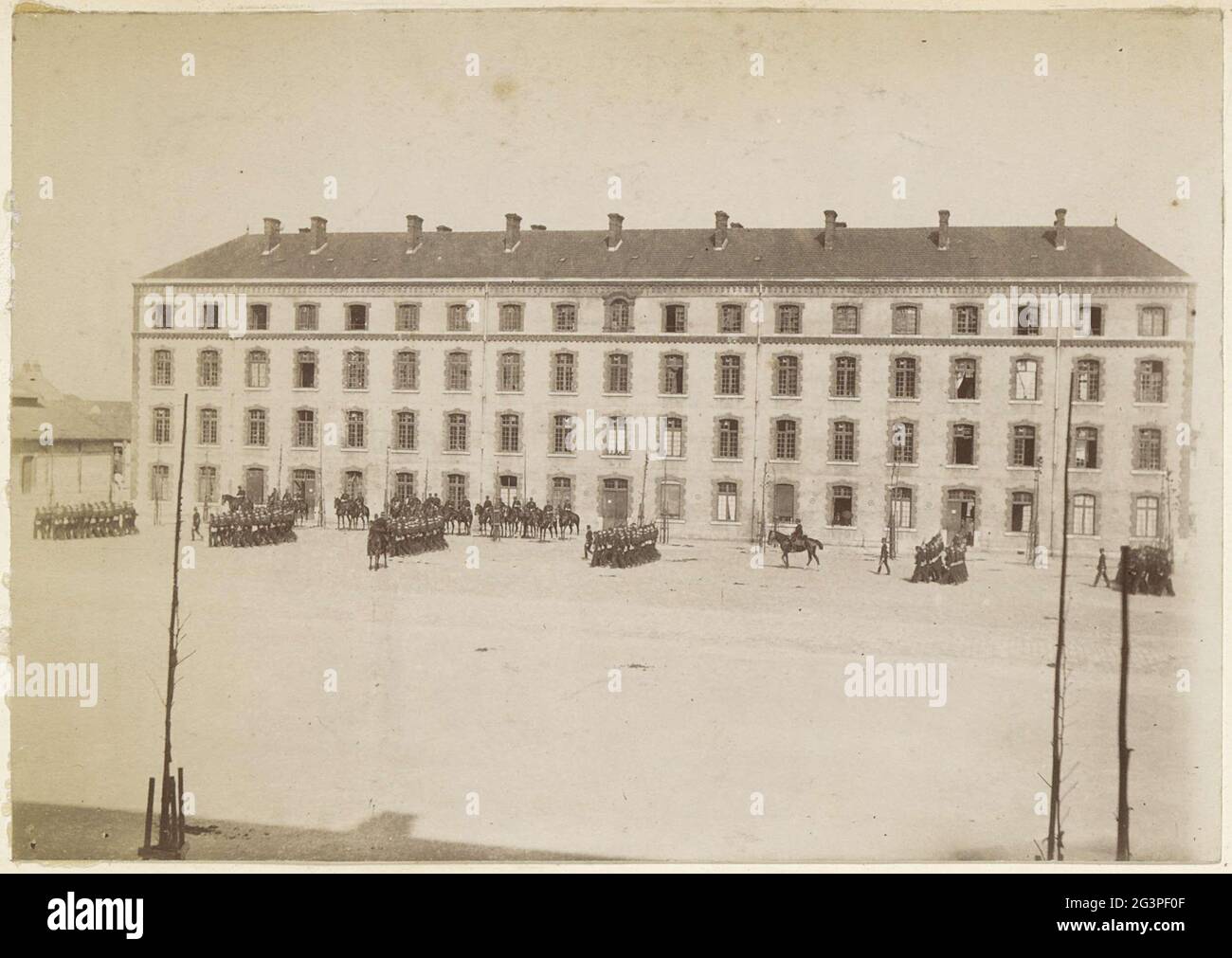 Barracks with marching soldiers in front in France. Part of photo album ...
