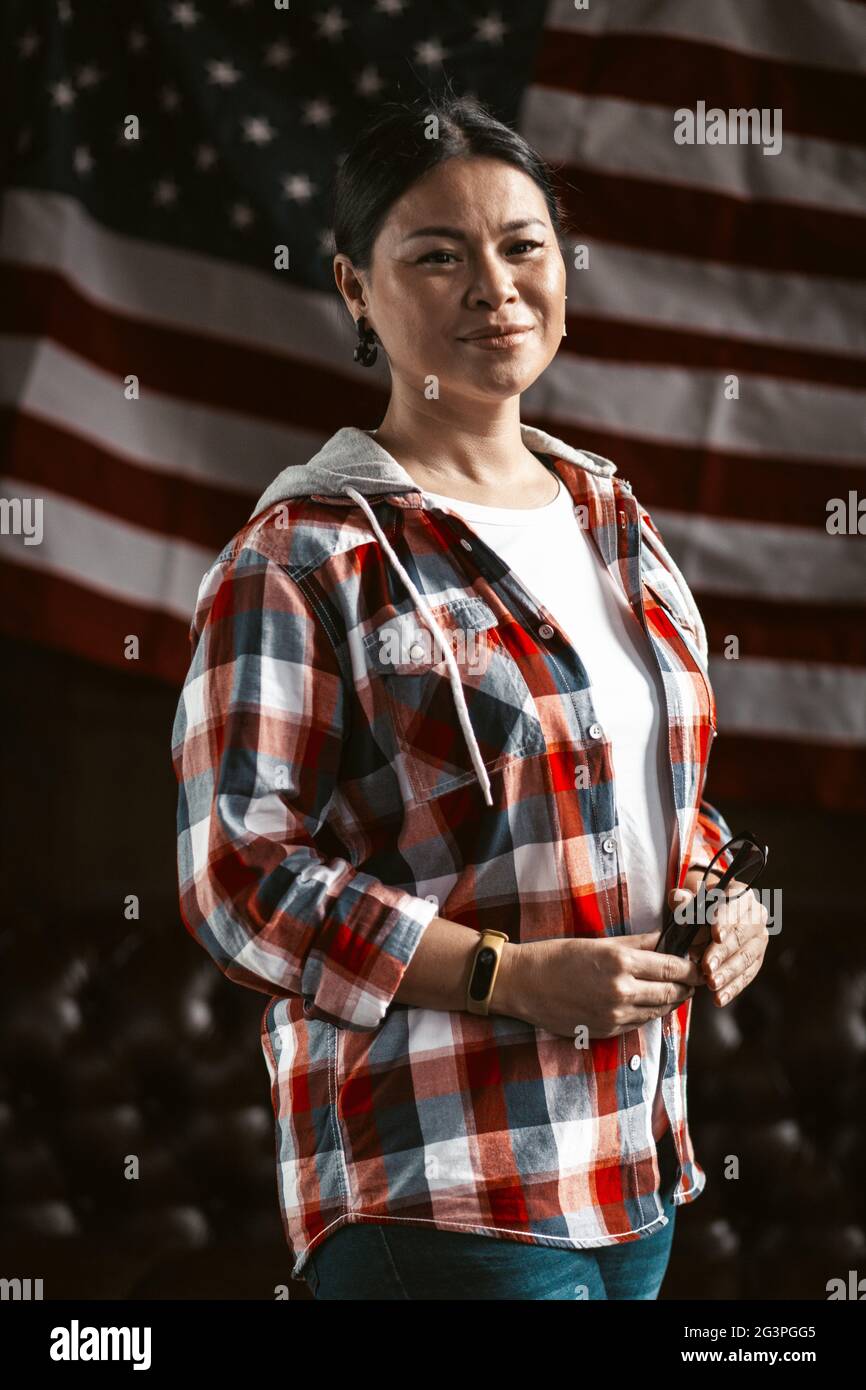 American Patriotic Woman Cheerful Smiles On America's Flag Back Stock ...