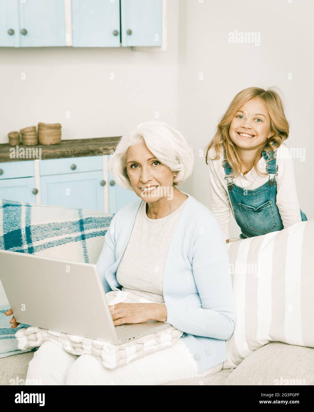 Happy Granny And Little Girl Using Wireless Internet At Laptop Stock ...