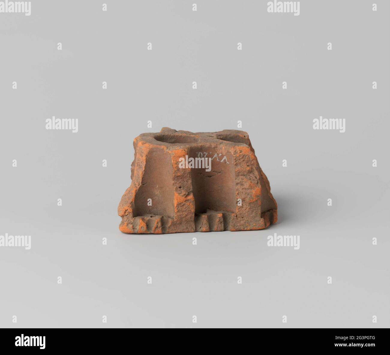 Fragment of a tile. Fragment of a tile of pottery. On the tile two ...