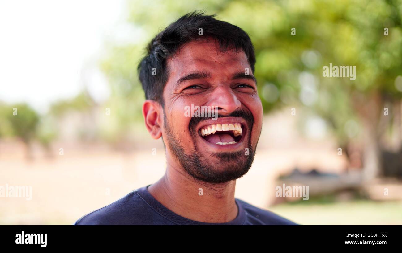 Portrait of very excited young Indian bearded man, celebrating victory ...