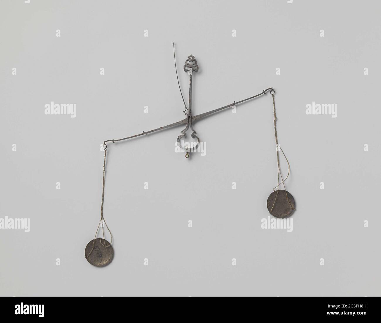 Gold balance. A gold balance with a silver scale Stock Photo - Alamy