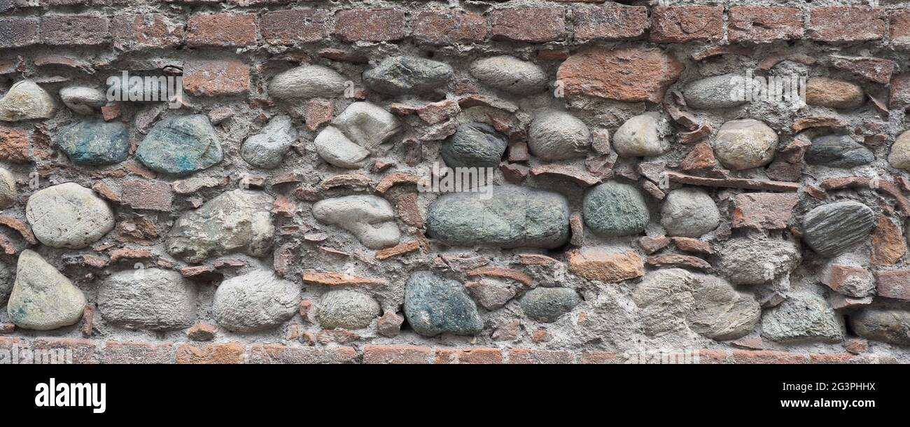 Wide old brick stone wall background Stock Photo - Alamy