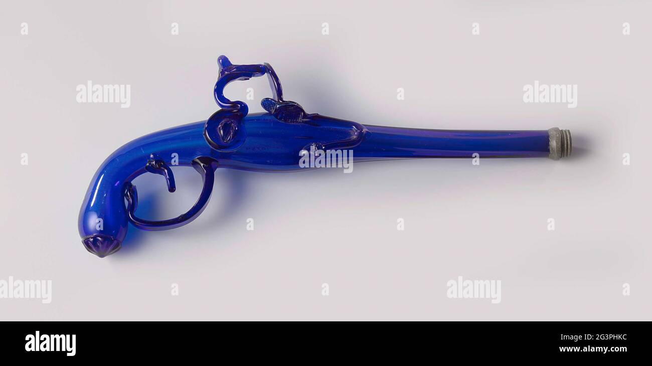Glass in shape of a gun. Flask and loop from a faintly ribbed, blue ...